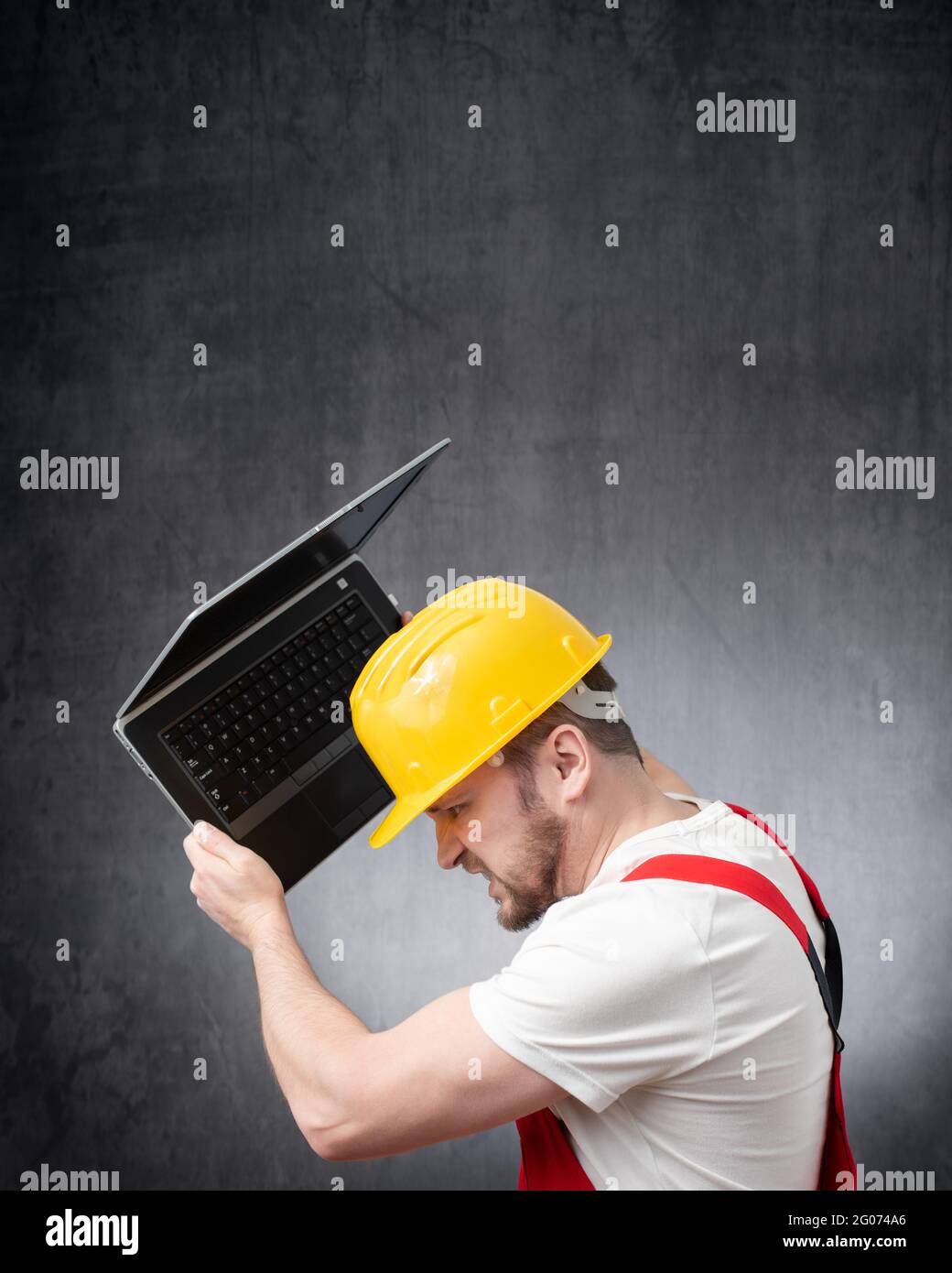 Angry worker breaking laptop hi-res stock photography and images - Alamy