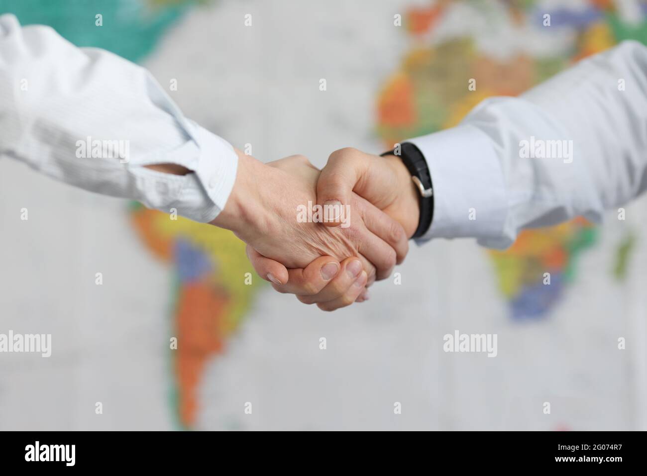 Business people handshake on background of world map of world Stock ...
