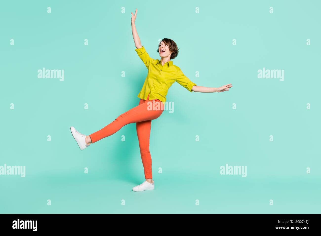 Full length body size photo of dancing on floor girl kicking smiling ...