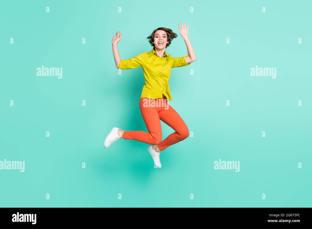 Full length body size photo of jumping high woman waving hands greeting ...