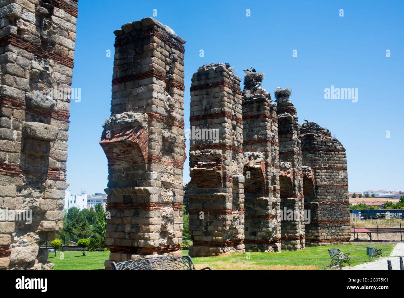 Ruins of roman ancient aqueduct at Merida. Summer sunny day with blue ...