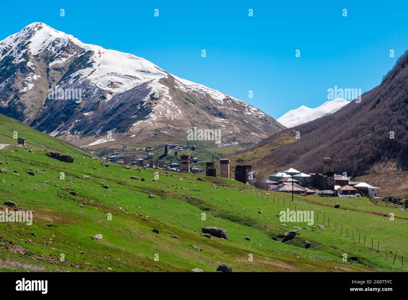 View of the Ushguli village at the foot of Mt. Shkhara. Picturesque and ...