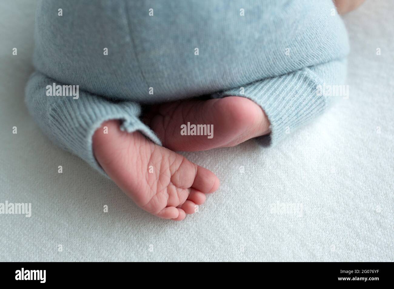 Baby feet. The tiny foot of a newborn in soft selective focus. Image of ...