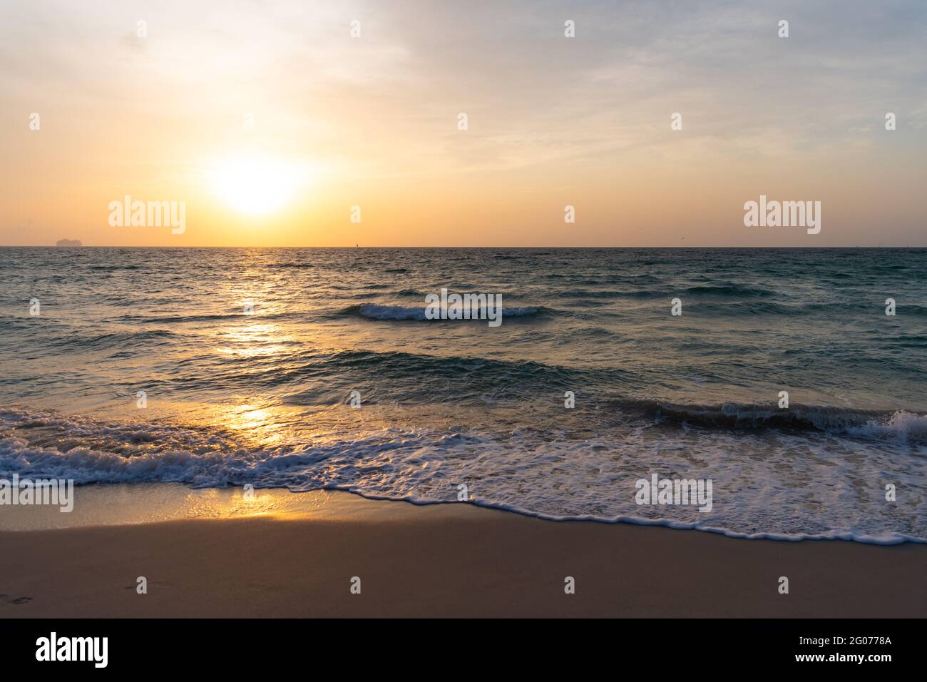 Ocean sunset on sea water with sunset sky and silhouettes of ship ...