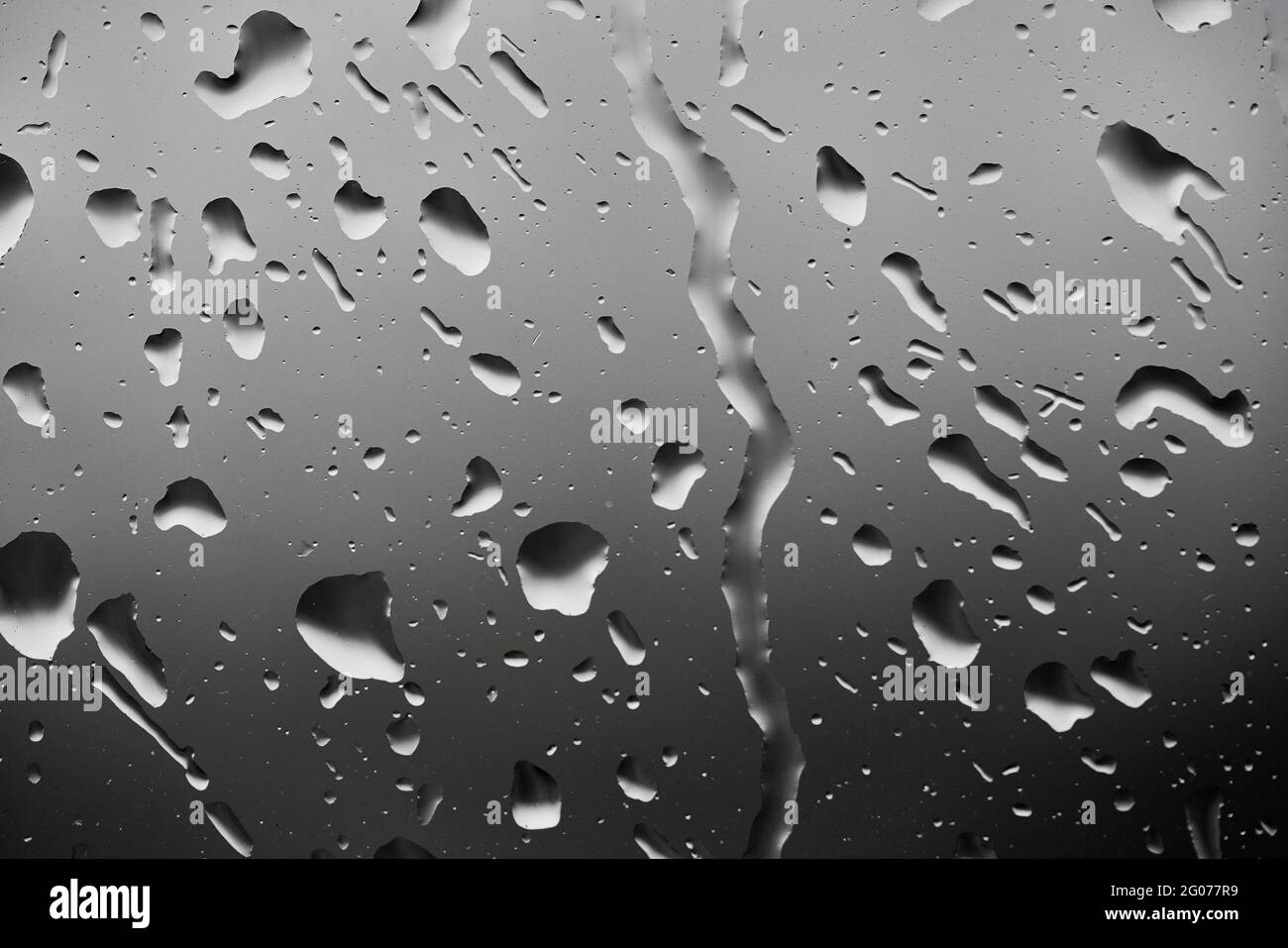 Image of water droplets on a clear glass surface during heavy rain ...