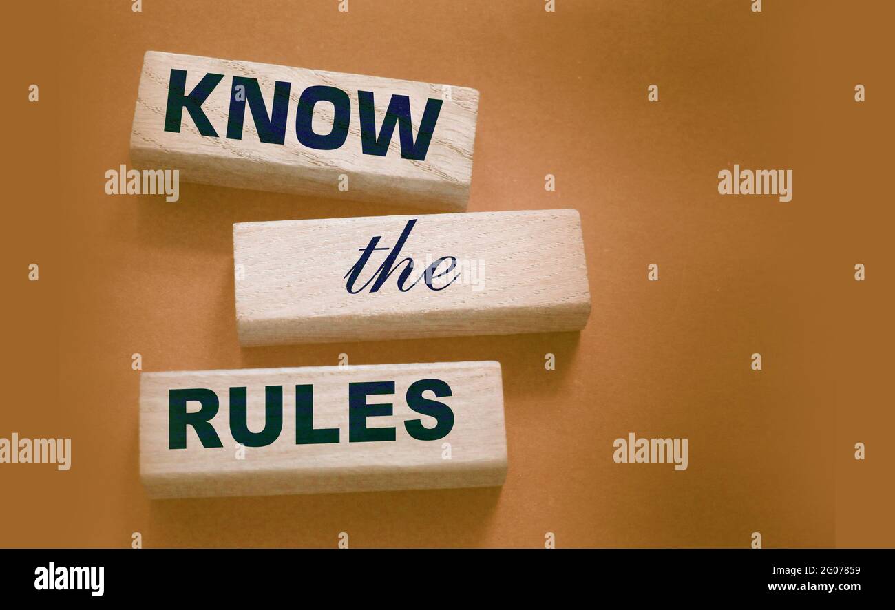 Know the rules word on wooden blocks isolated on dark grey background ...