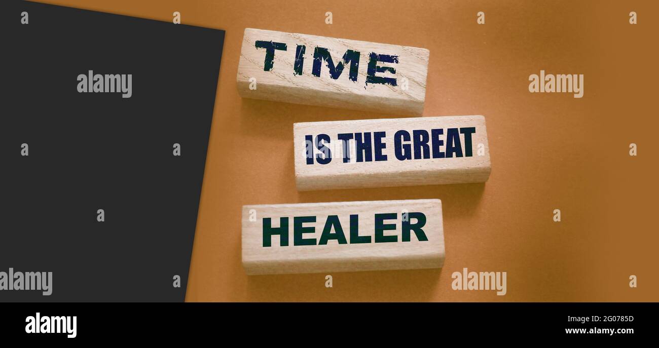 Time is the best healer words on wooden blocks. End of relationship and ...
