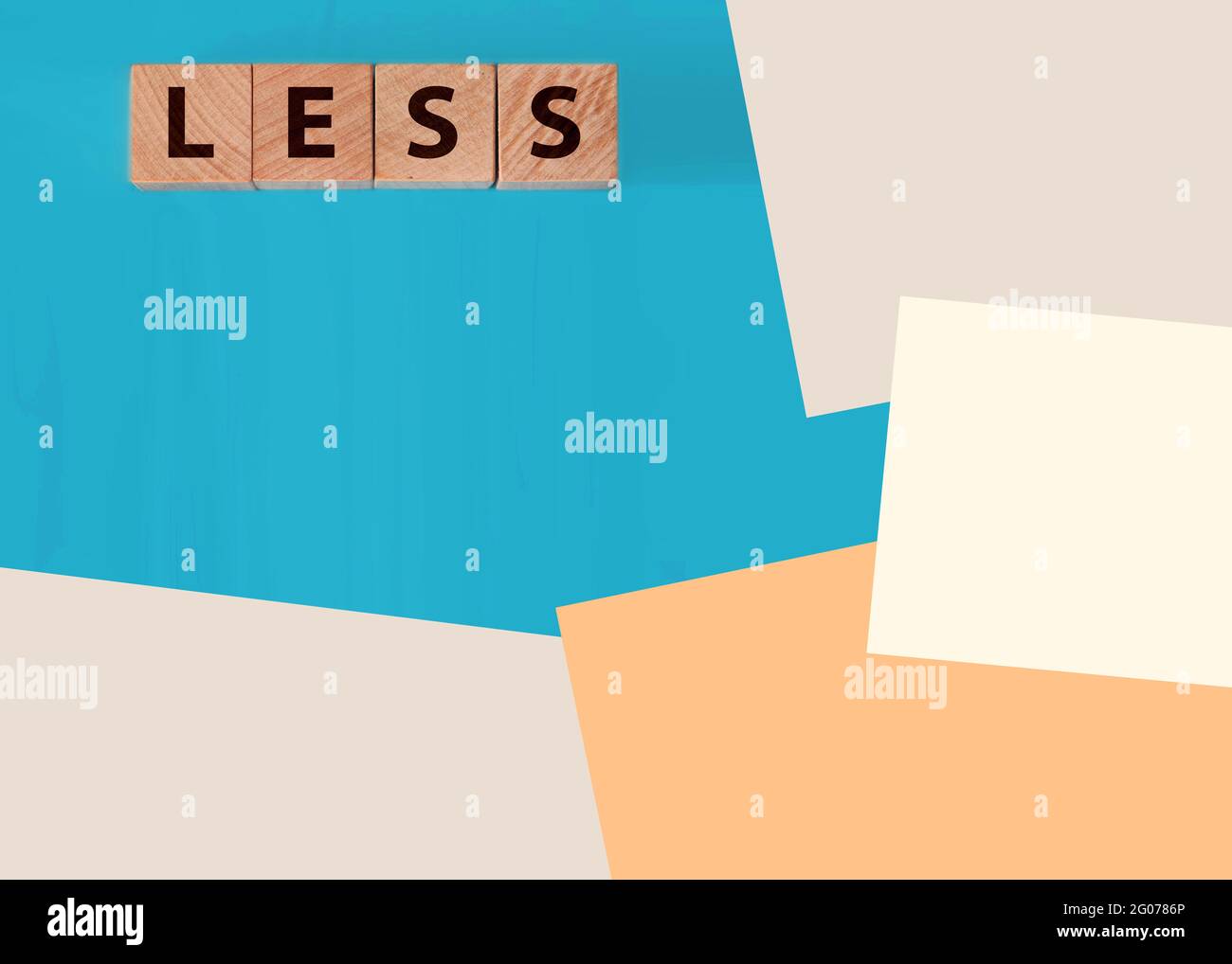 Less word on wooden cubic blocks with letters. cut costs business ...
