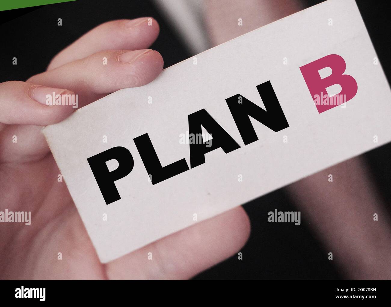 Plan B words on card in hand of businessman wearing suit and tie ...