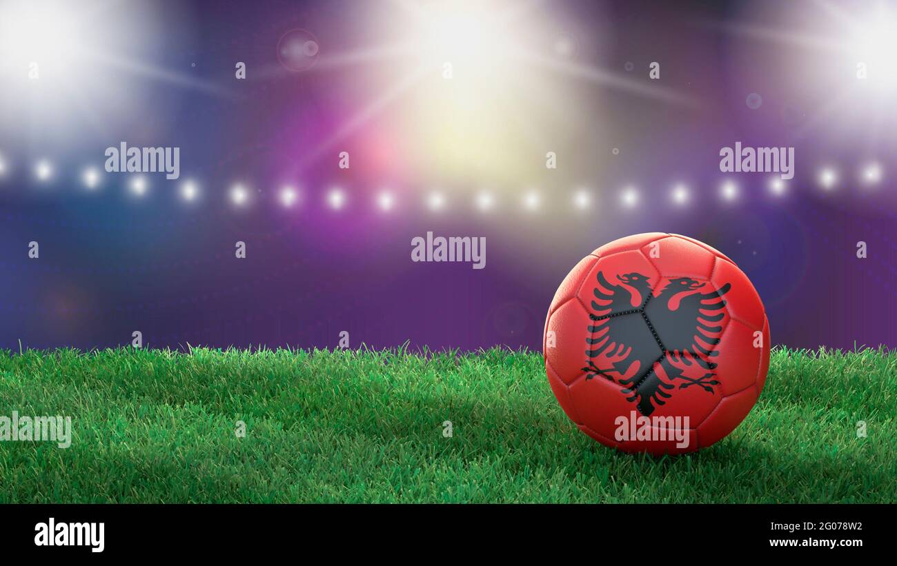 Soccer ball in flag colors on a bright blurred stadium background ...