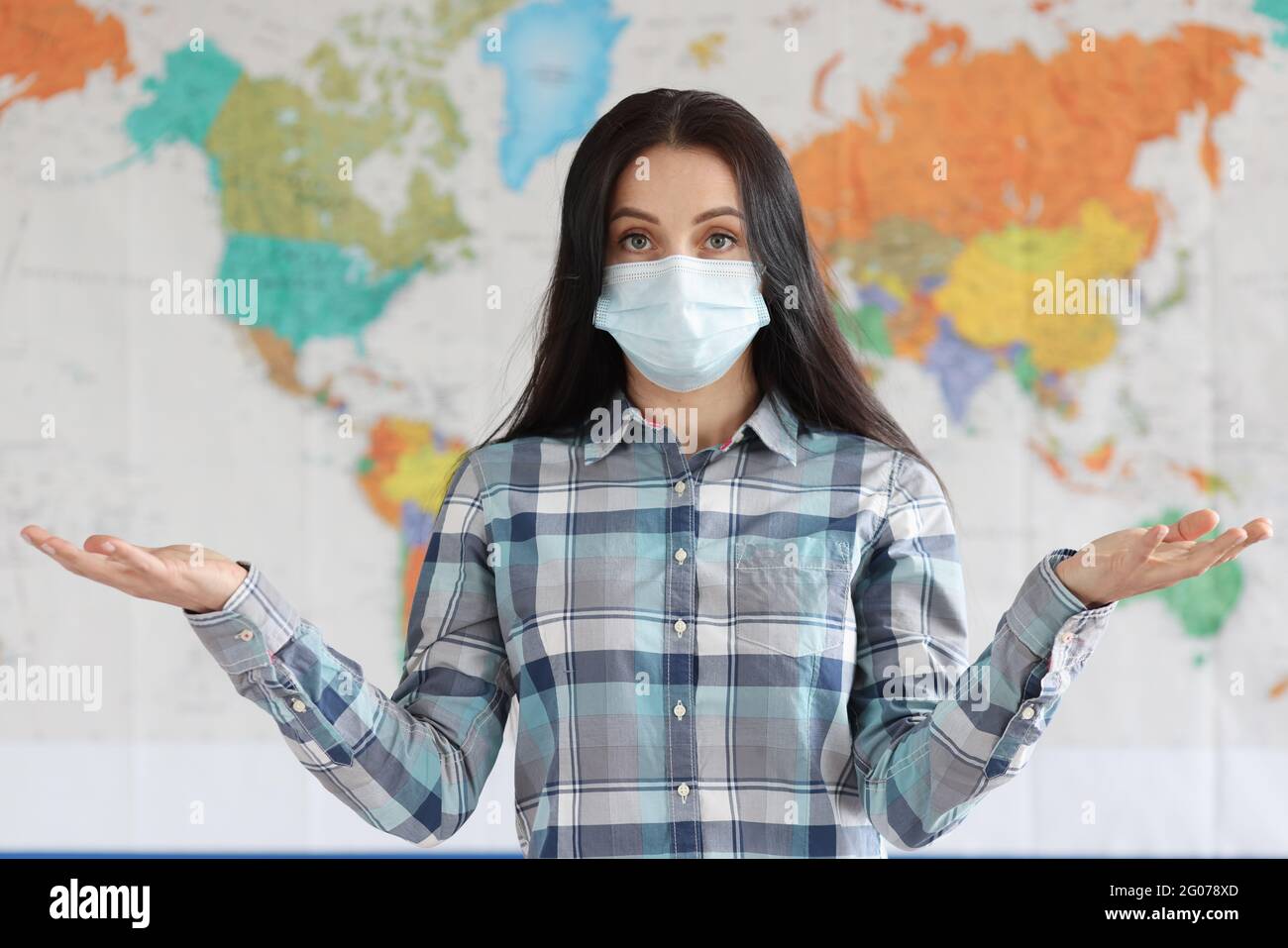 Portrait Of Woman In Medical Protective Mask Against Background Of
