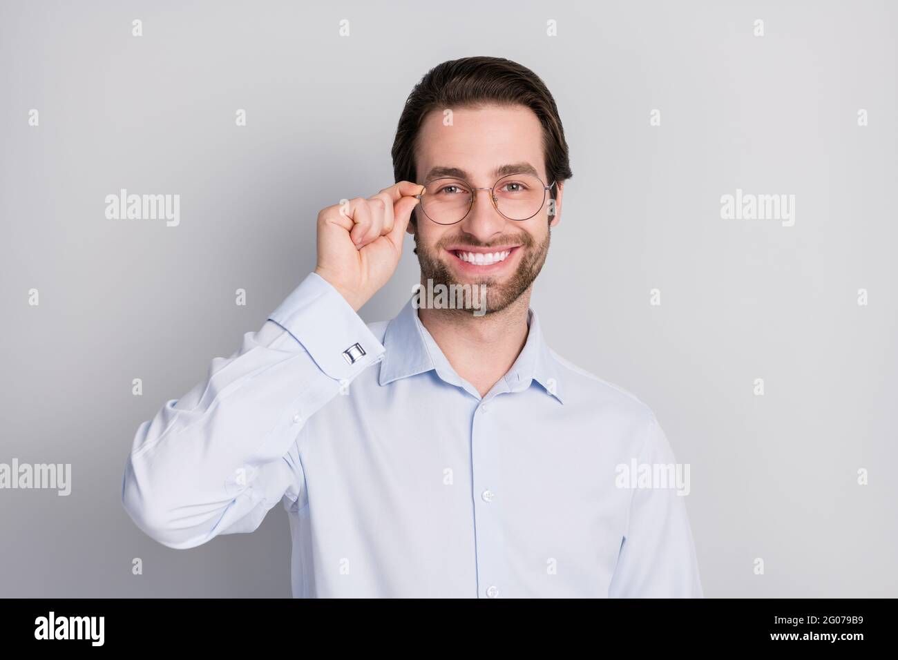Portrait of attractive skilled experienced cheerful man expert touching ...