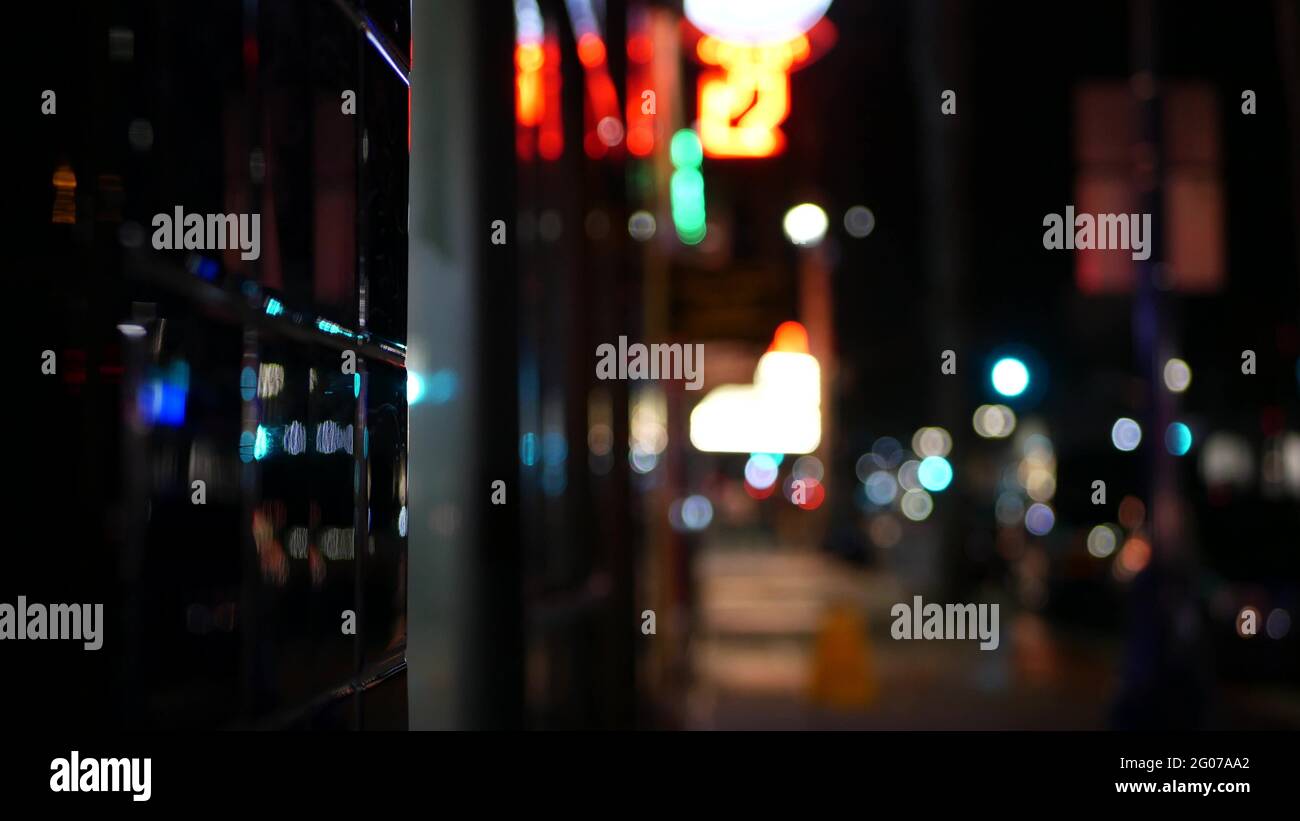 Defocused evening street, blurred bokeh. Lights of city and cars on ...