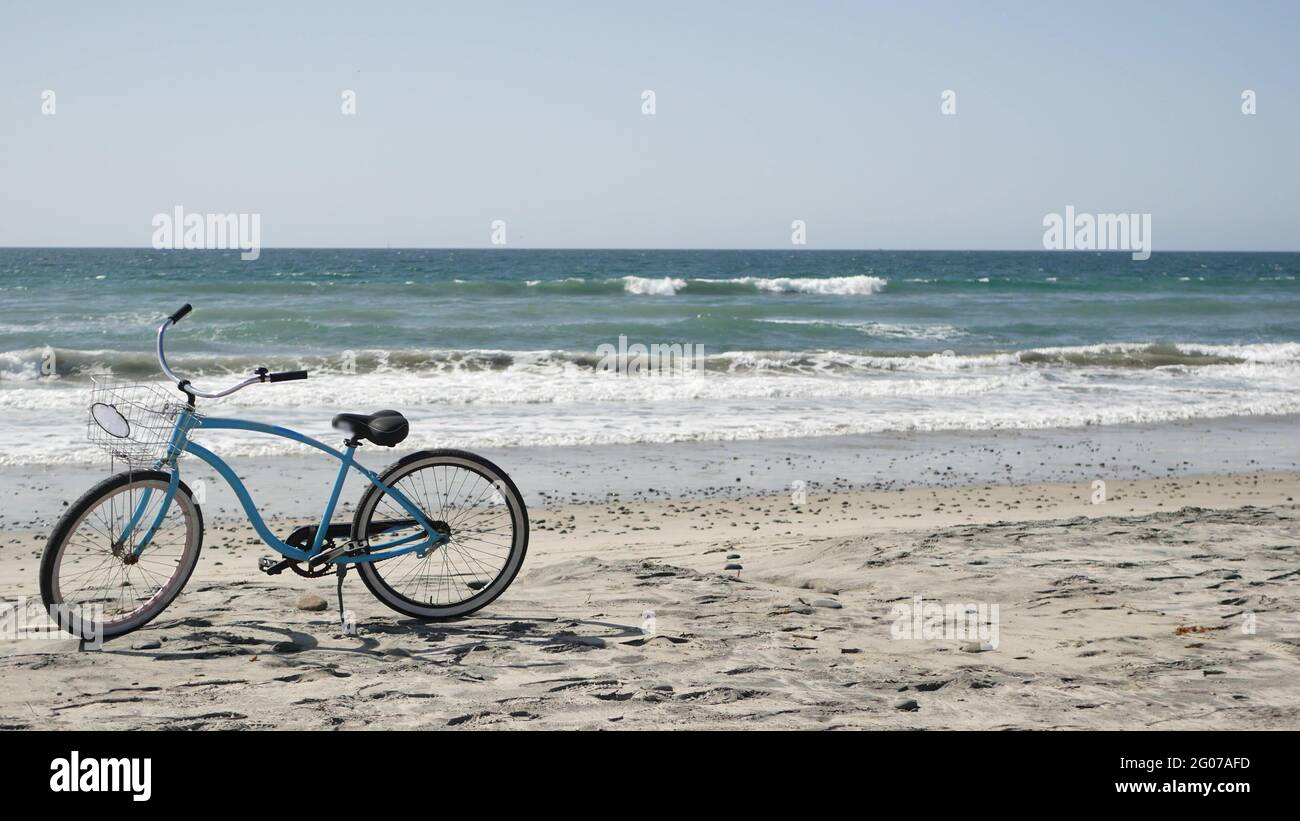 Blue bicycle, cruiser bike by ocean beach pacific coast, Oceanside ...