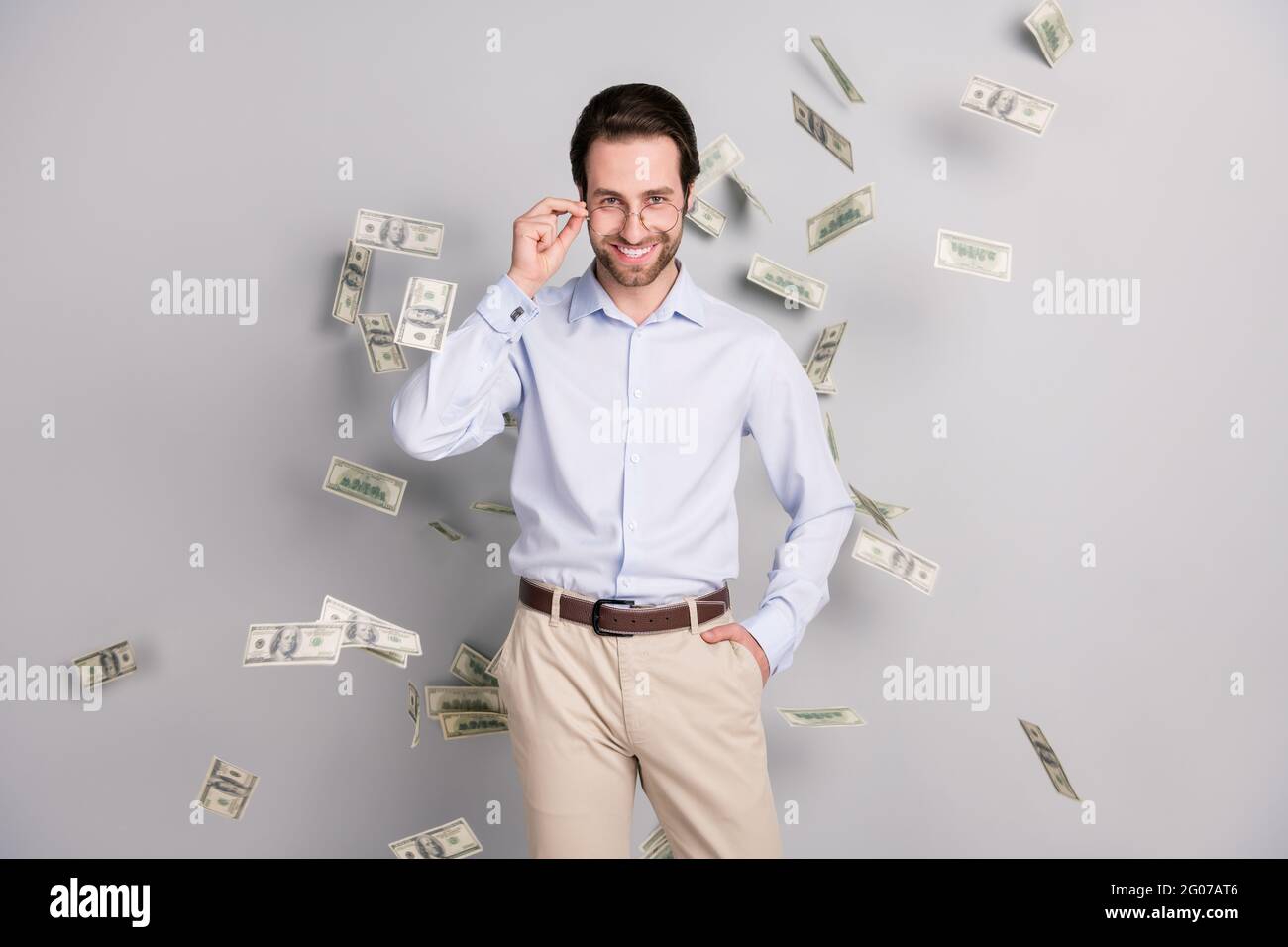 Portrait of attractive trendy cheerful man cash flow money falling ...