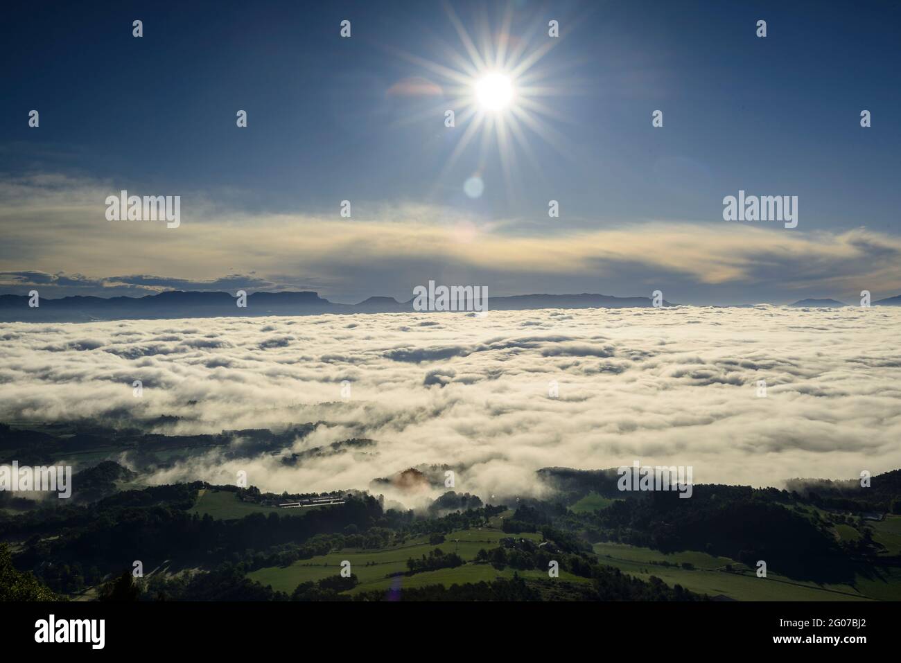 Foggy spring sunrise in Plana de Vic, seen from Sant Bartomeu del Grau ...