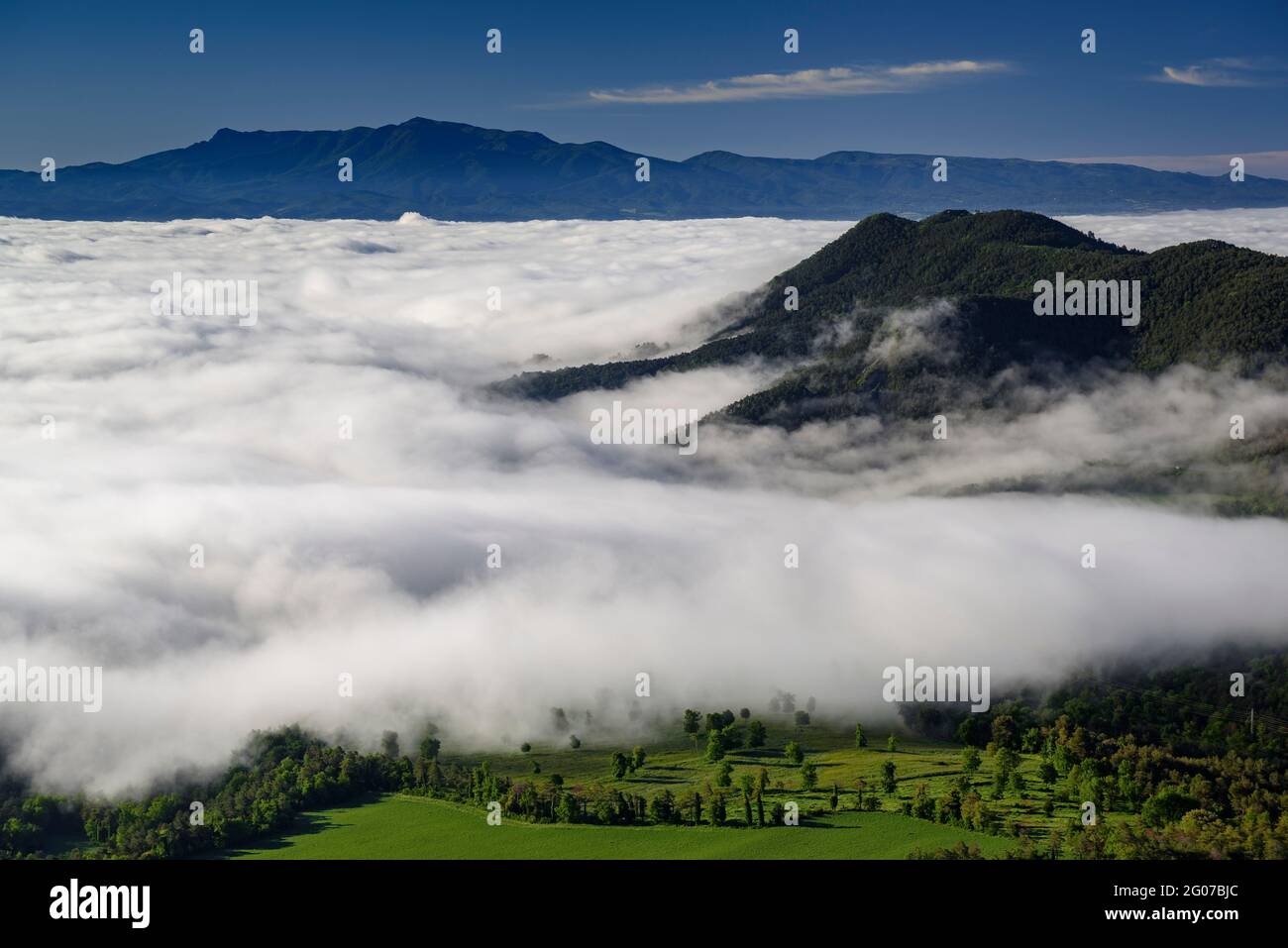 Foggy spring sunrise in Plana de Vic, seen from Sant Bartomeu del Grau ...