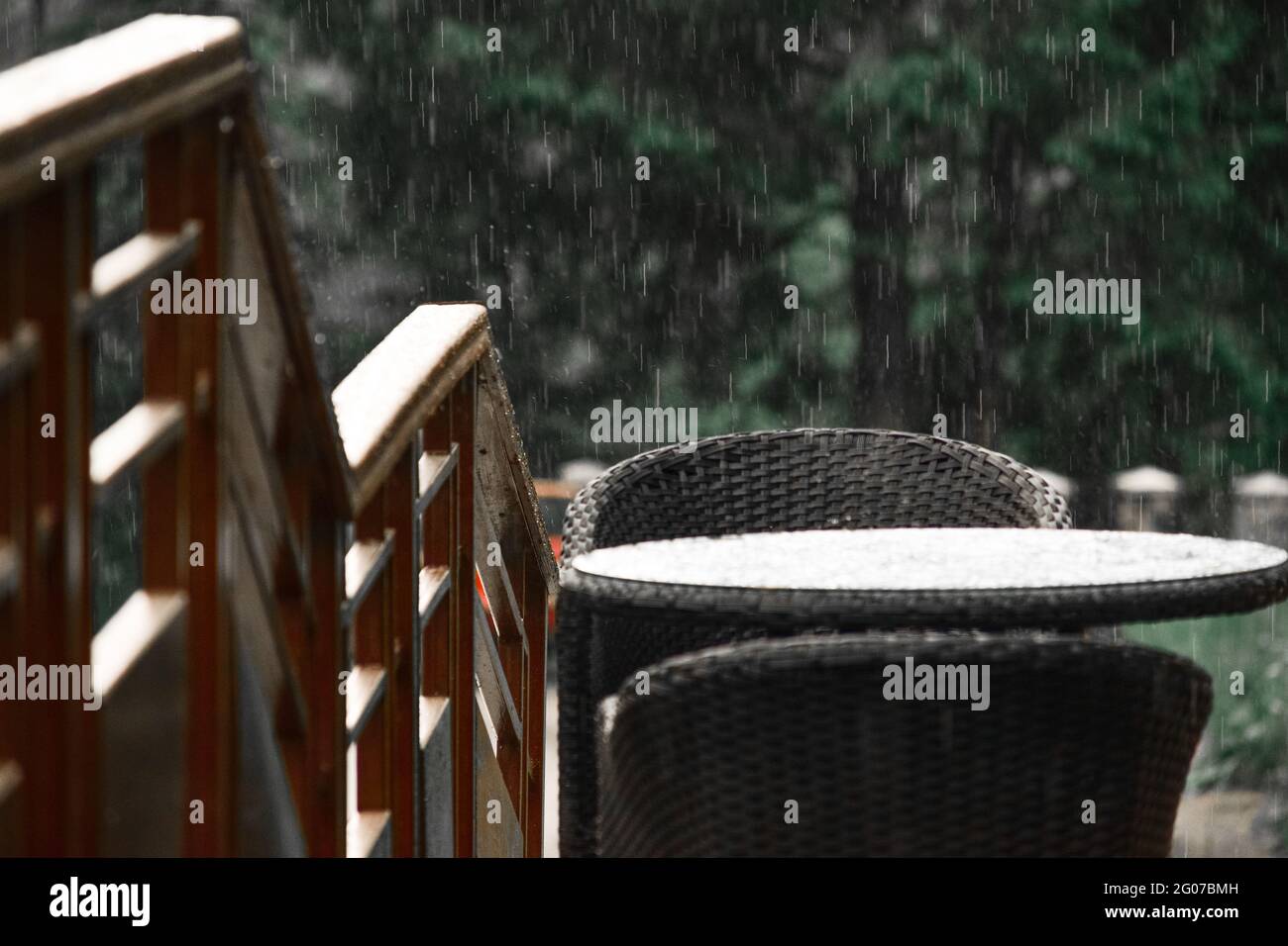 Closeup shot of a table with chairs on a patio Stock Photo - Alamy