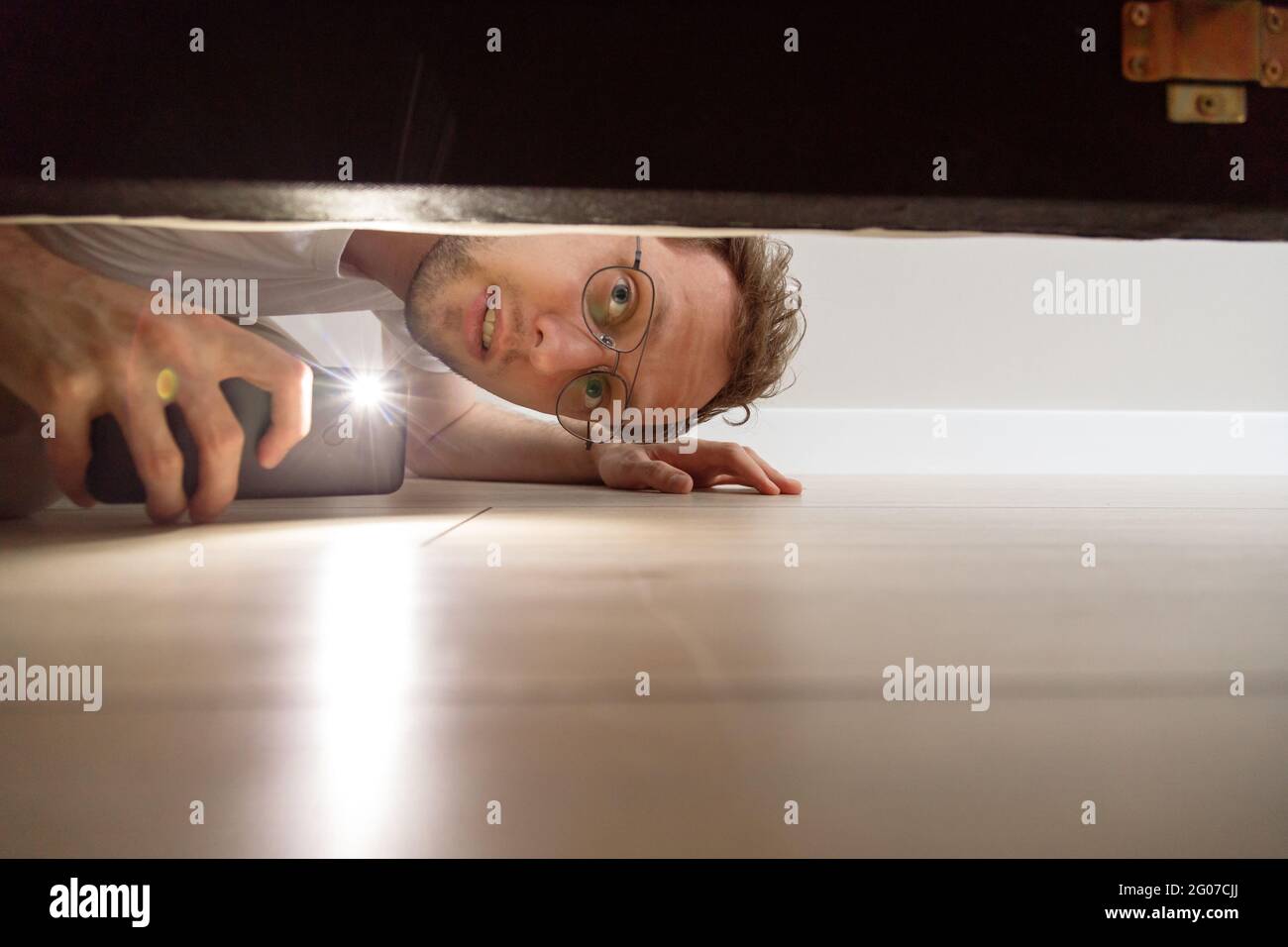 Searching under the bed hi-res stock photography and images - Alamy