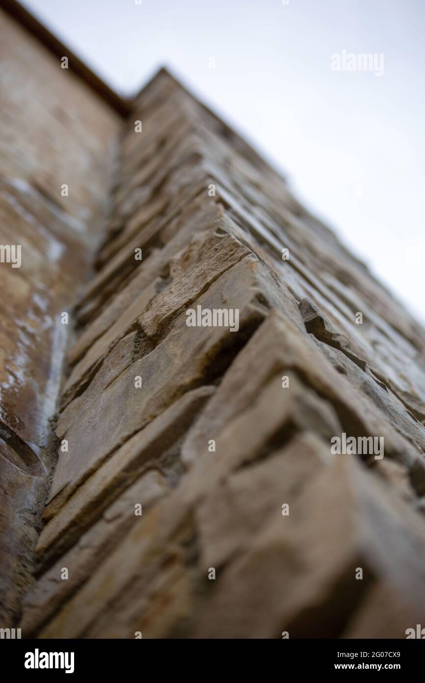 Vertical low angle shot of an old stone wall Stock Photo - Alamy