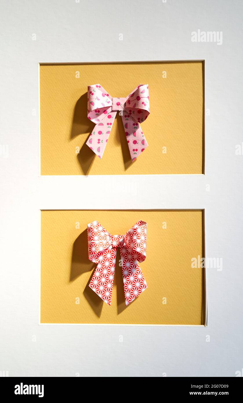 colored paper bows, Handmade with origami technique. Concepts of ...