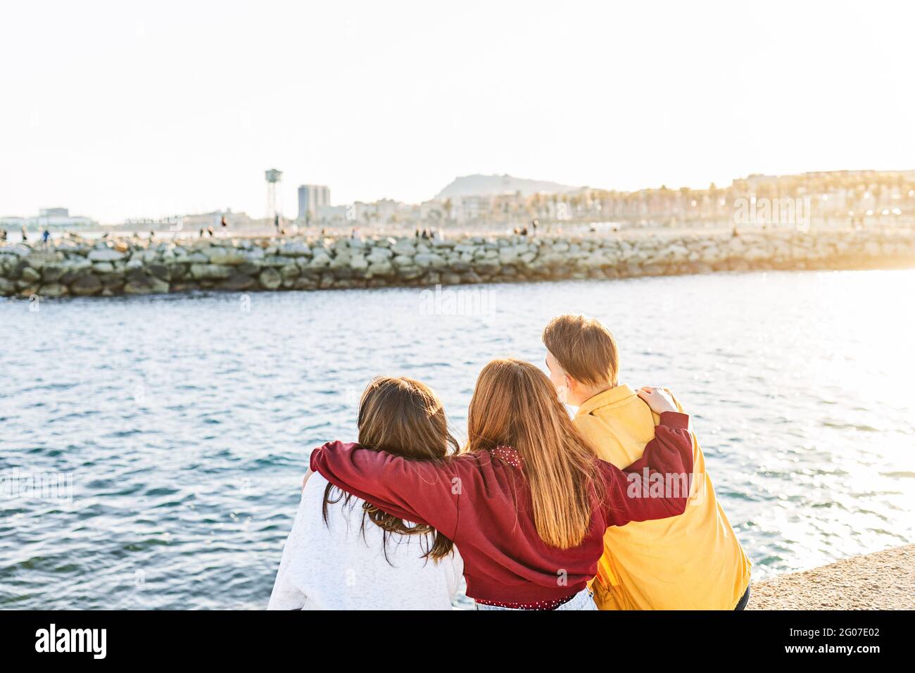 Three friends hugging adult hi-res stock photography and images - Alamy