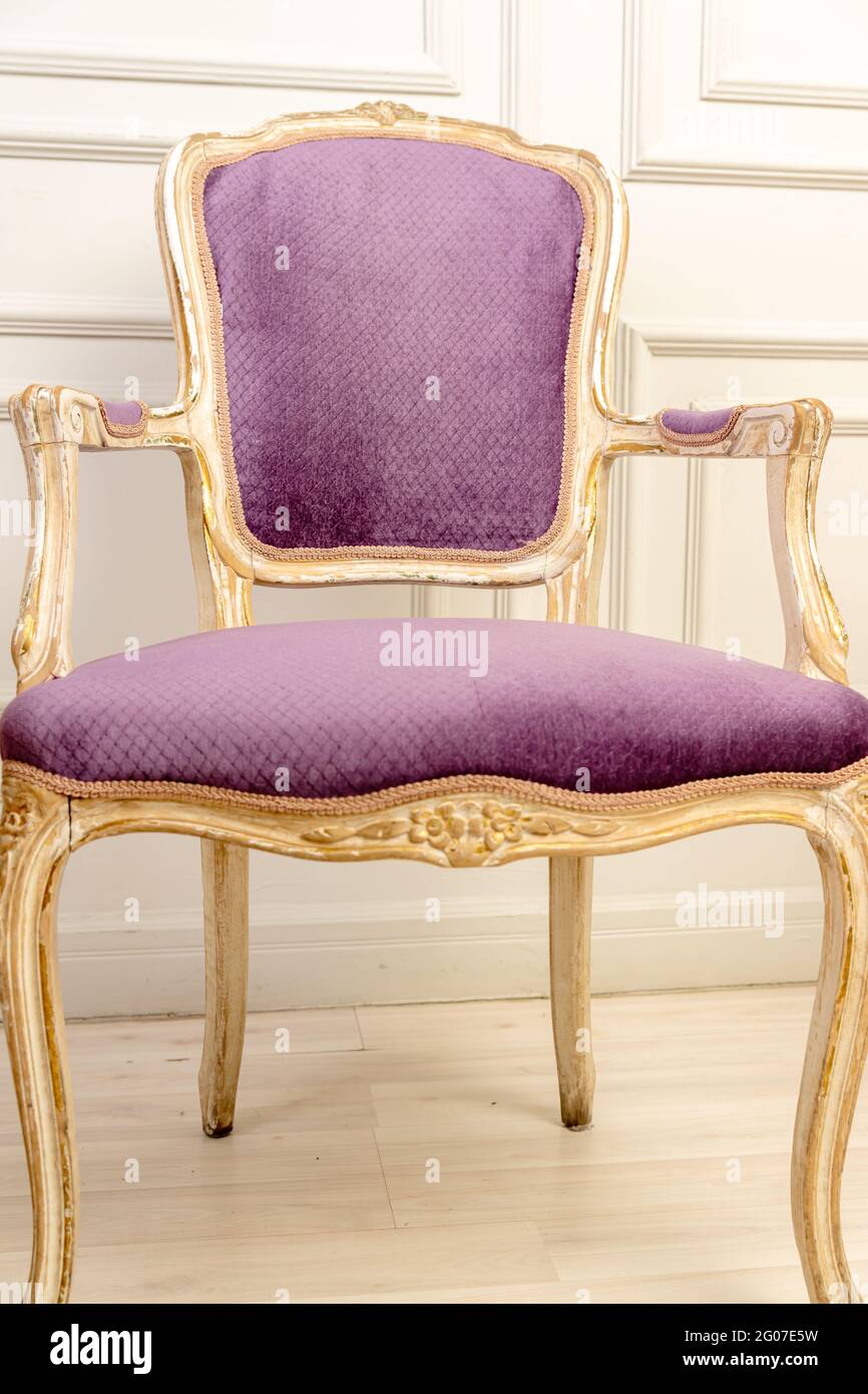 Purple Vintage classical farbirc style Chair indoors Stock Photo - Alamy