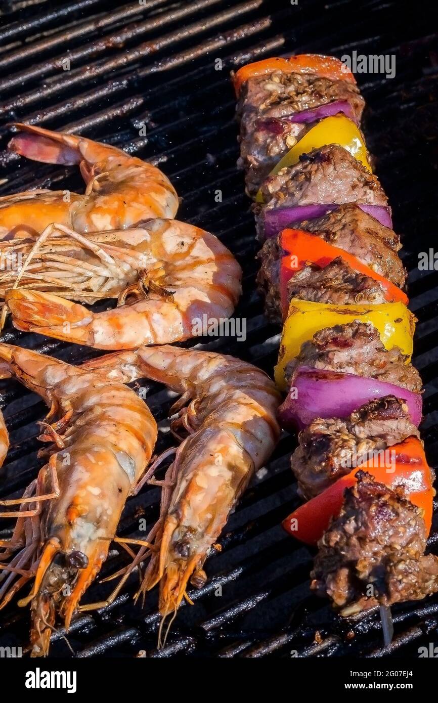 Prawns and Lamb Kebabs cooking on a barbeque Stock Photo - Alamy