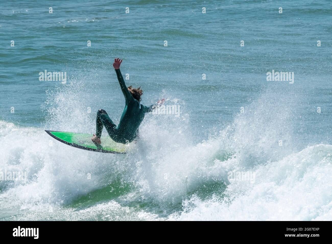 Spectacular surfing action as a surfer gets airborne at Fistral in ...