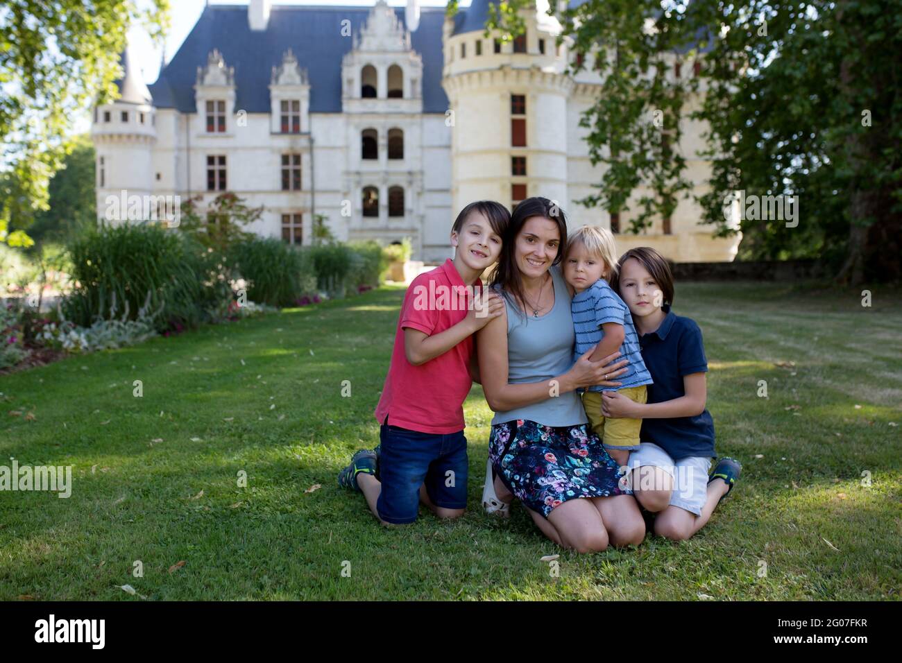 Child, toddler boy, playing in gardens of the Azay Le Rideau castle in ...