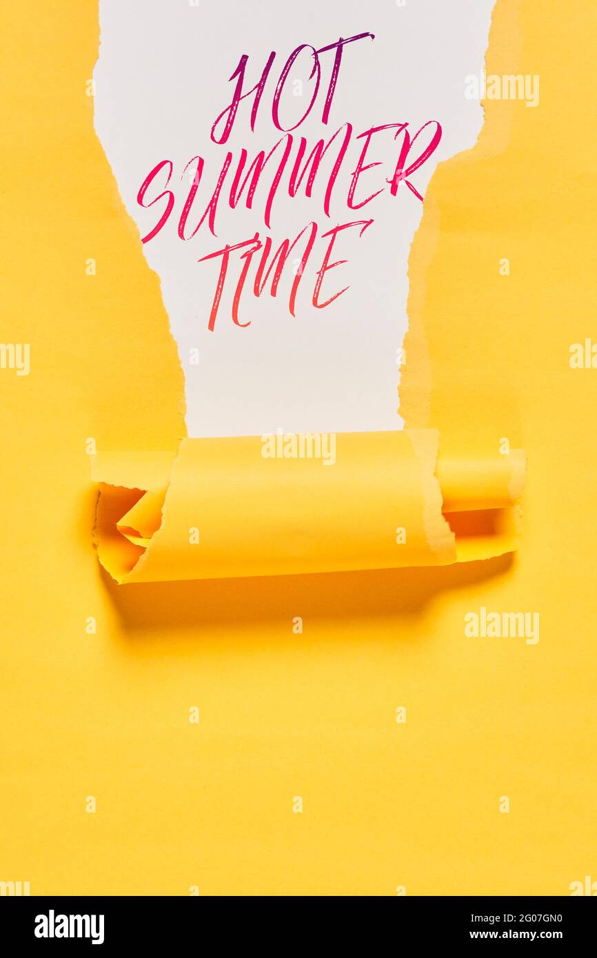 Caption - hot summertime on yellow and white background. Torn paper ...