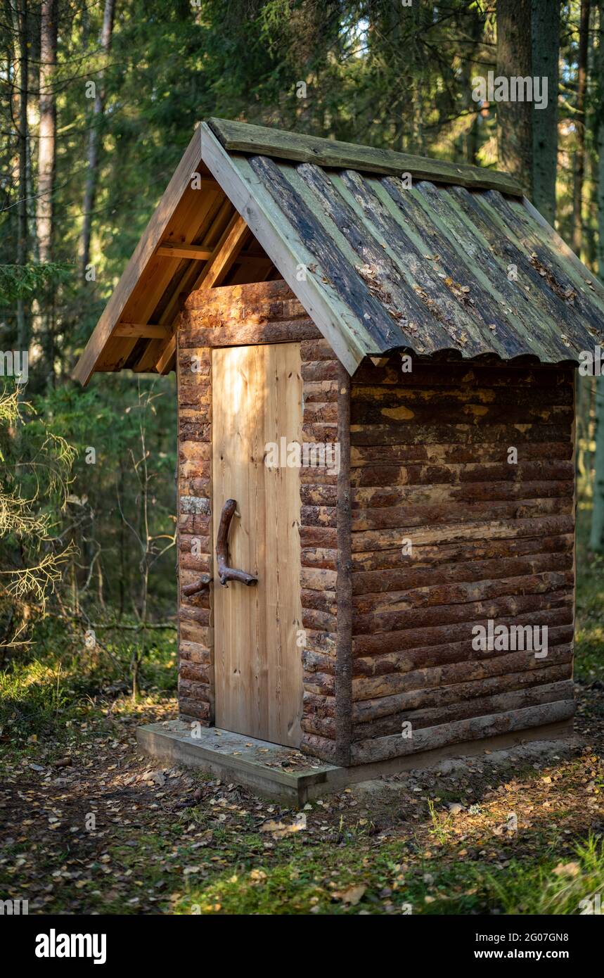 small wooden toilet house in the forest woods. recreation Stock Photo ...