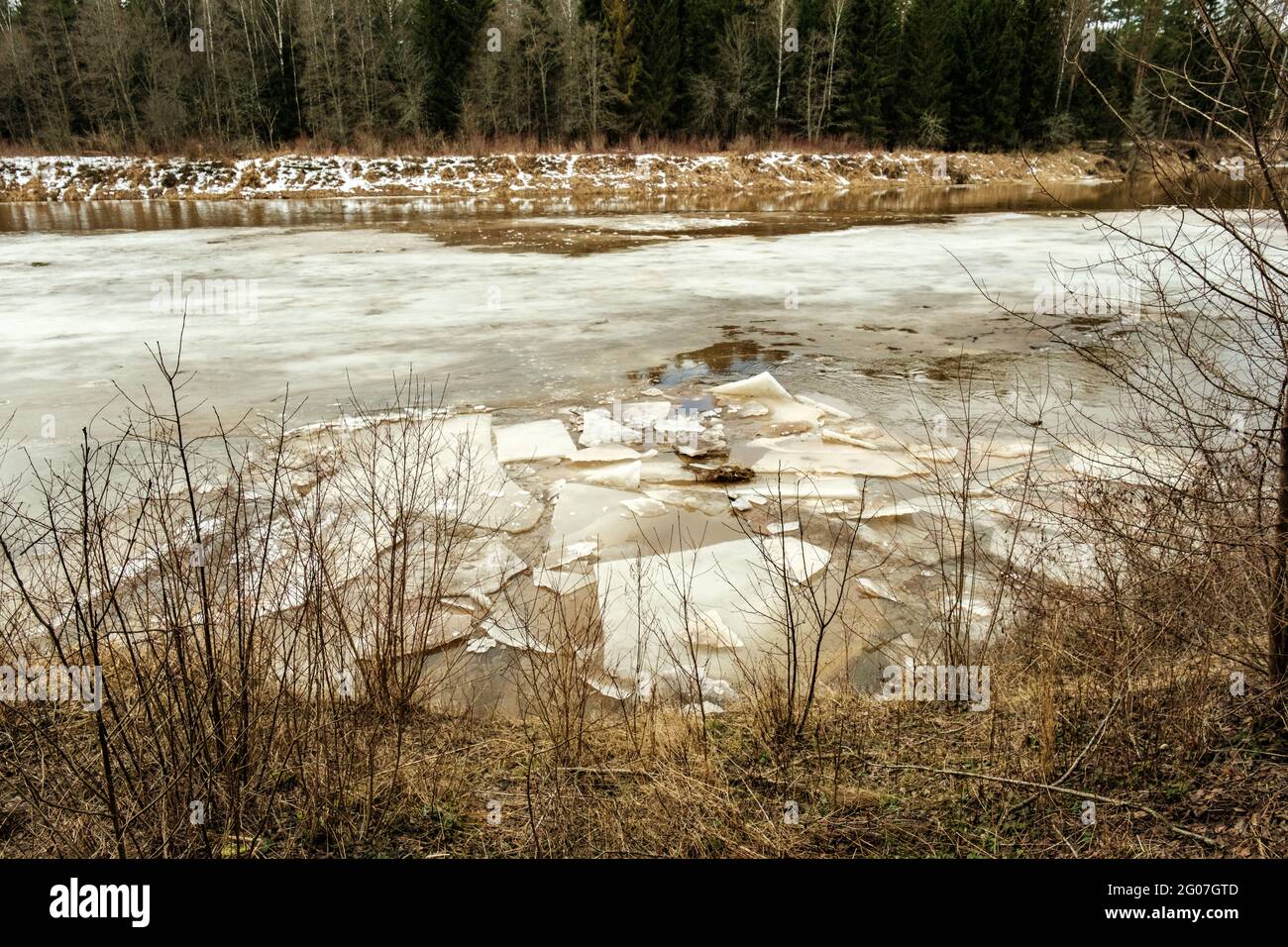 ice block covered river in winter with sandstone cliffs Stock Photo - Alamy