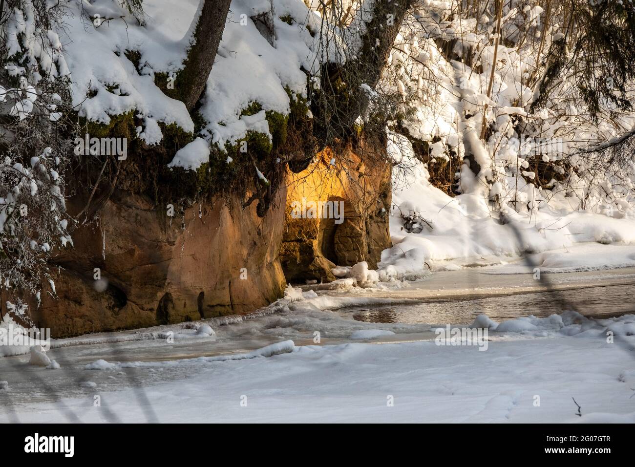 ice block covered river in winter with sandstone cliffs Stock Photo - Alamy