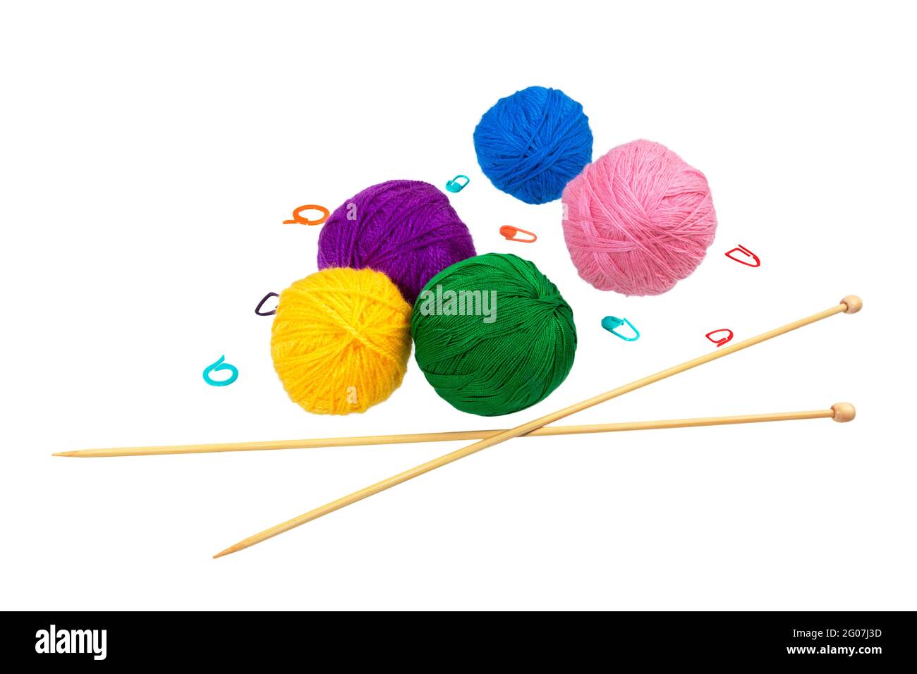 Colorful yarn balls with needles and clip isolated on a white ...