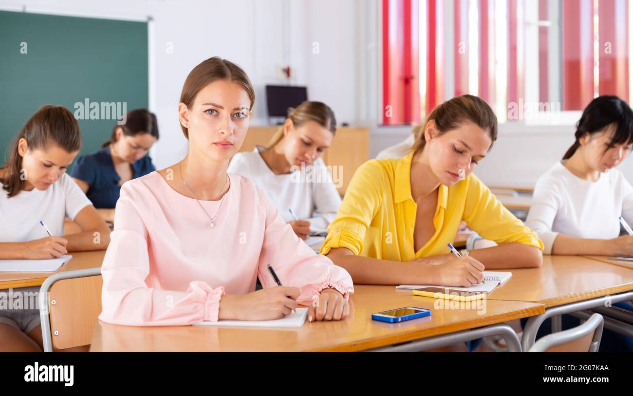 Female student during lesson Stock Photo - Alamy