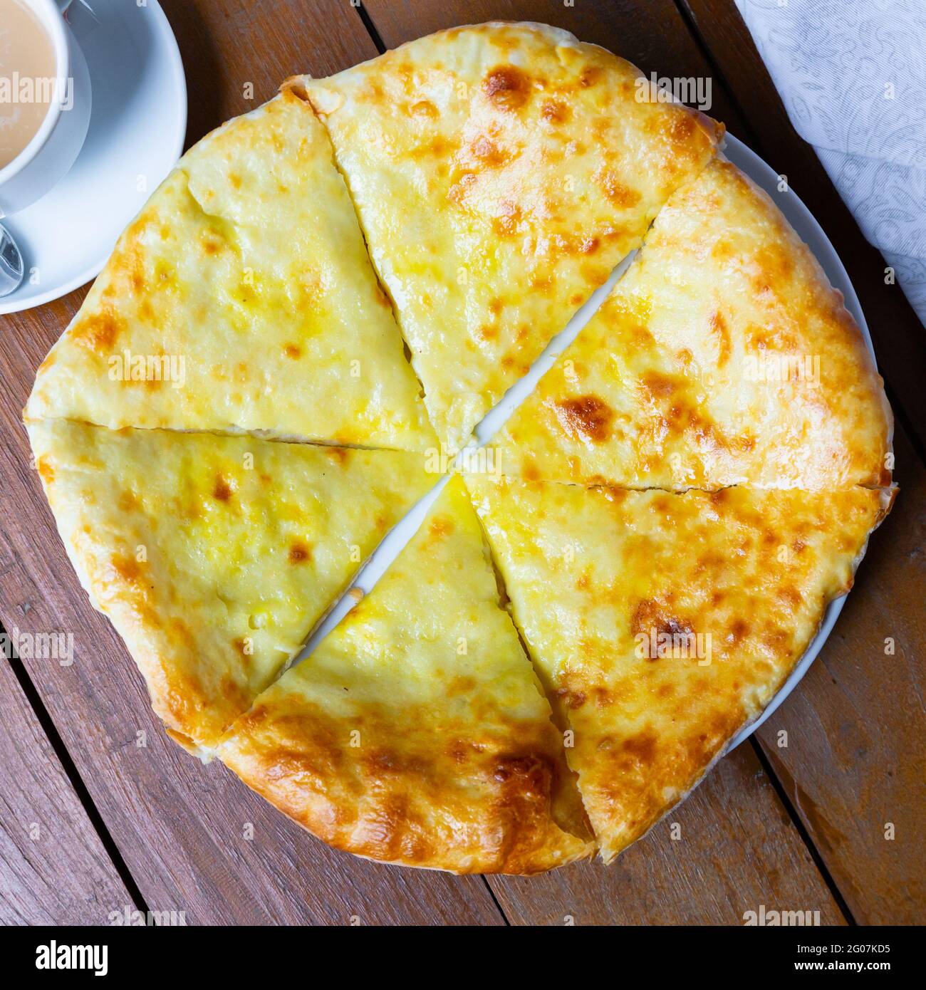 Sliced Megrelian khachapuri with melted suluguni cheese Stock Photo - Alamy