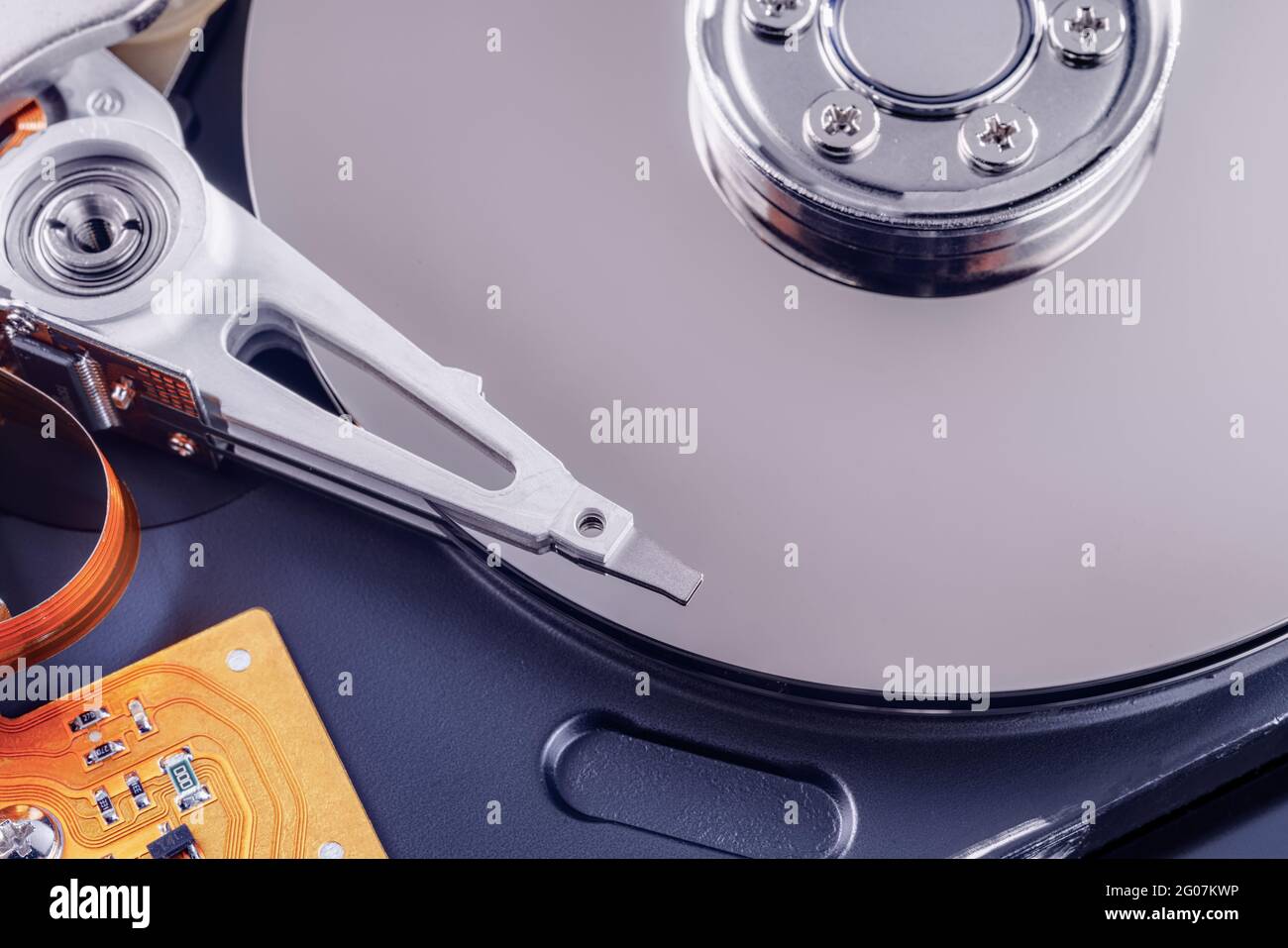 Disassembled hard drive close up with plates and head unit visible ...