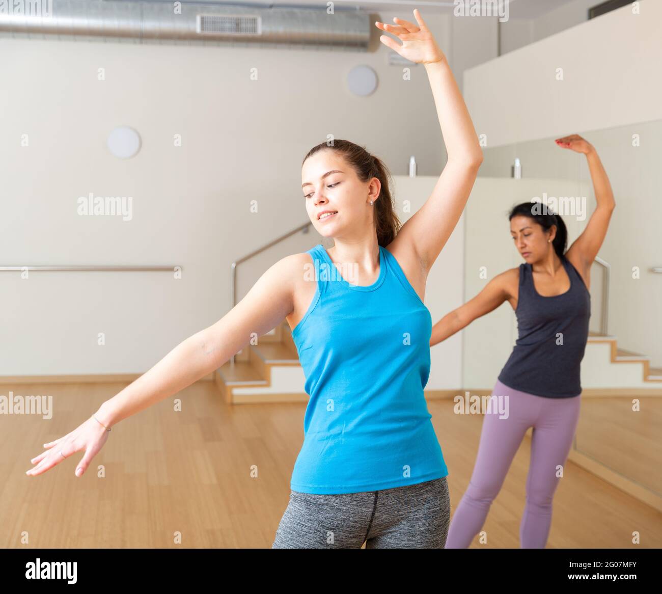 Group of smiling women training sport dance Stock Photo - Alamy