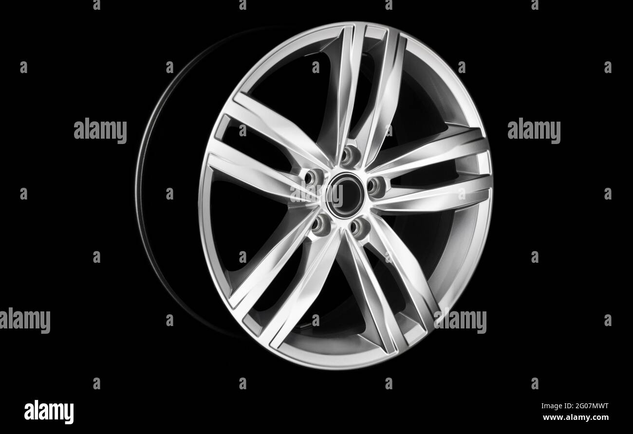 Aluminium modern car wheel rim in dramatic light at night. Vehicle rim ...
