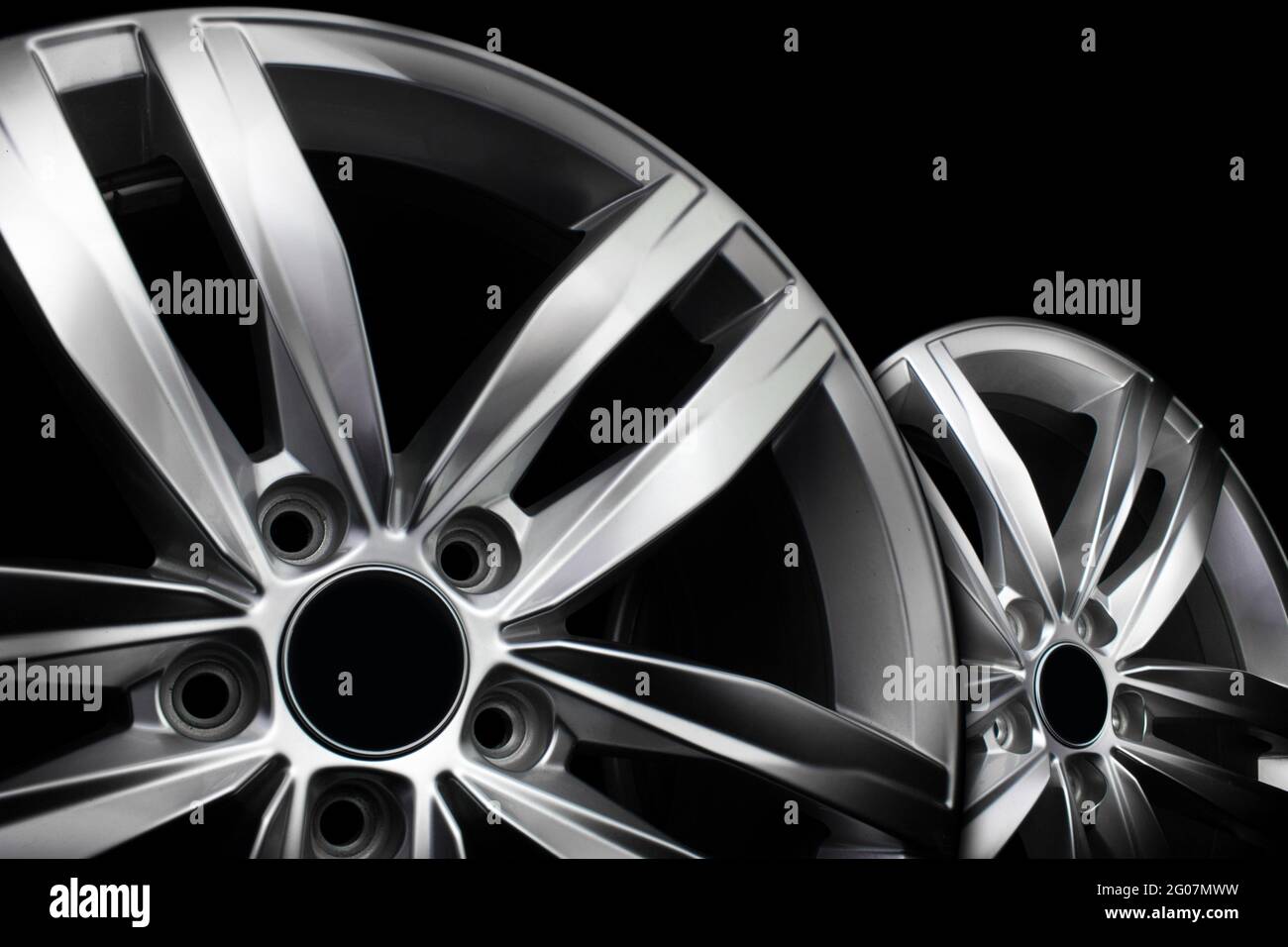 Pair of modern aluminium wheel rims isolated on black background Stock ...