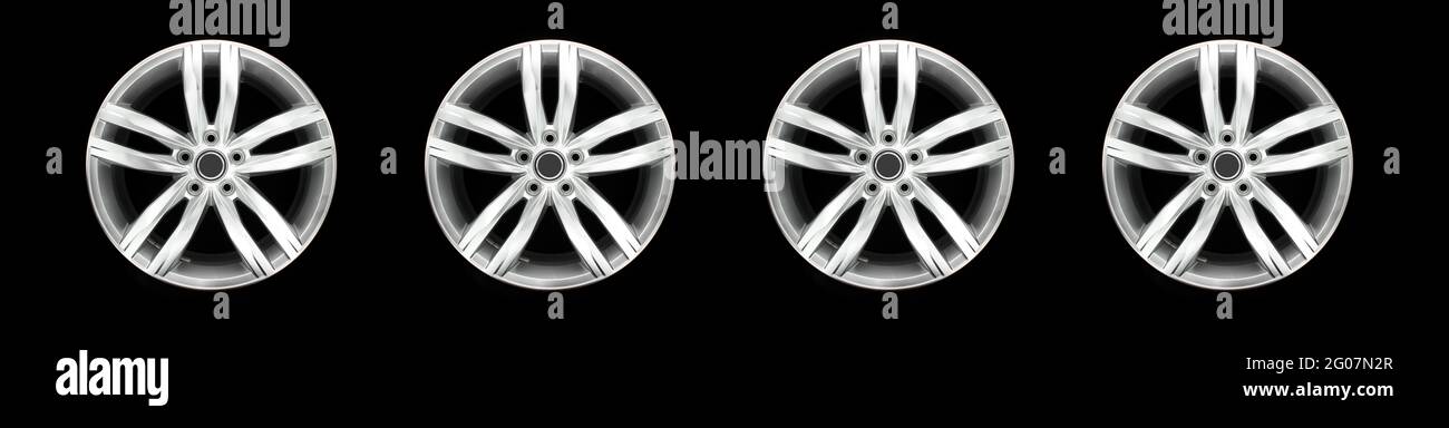 Front view on set of steel alloy aluminium car rims. Isolated on black ...
