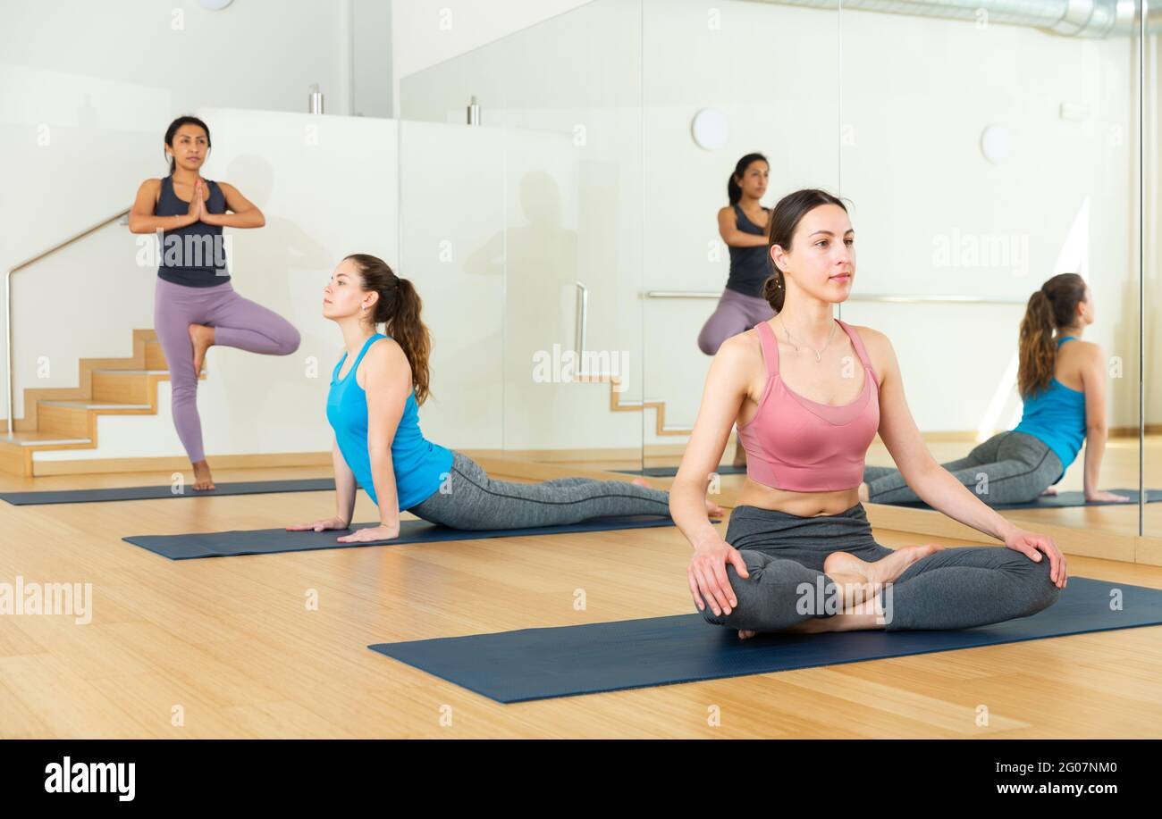 Young women in yoga poses hi-res stock photography and images - Alamy
