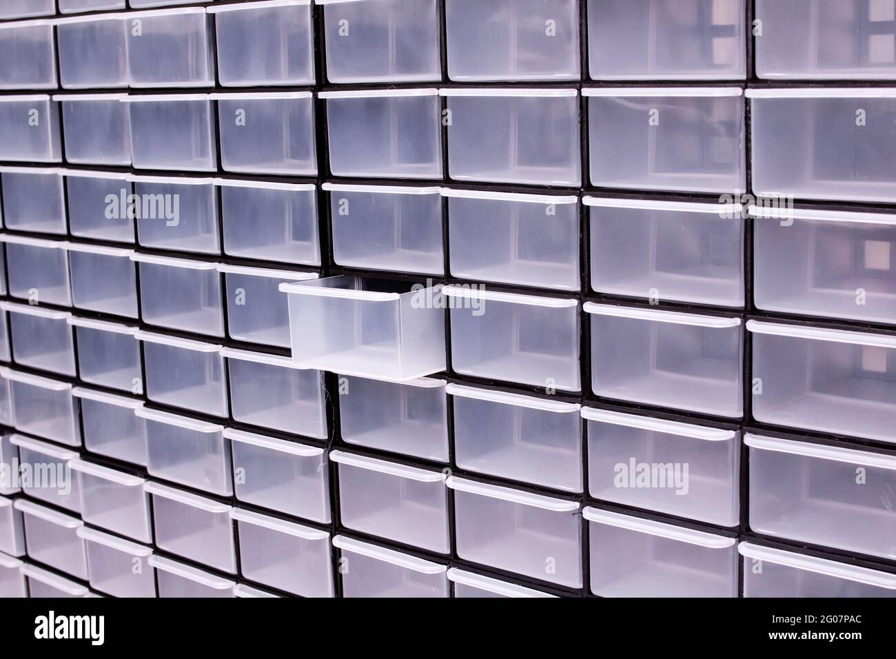 Plastic cells in the small change box close up Stock Photo - Alamy