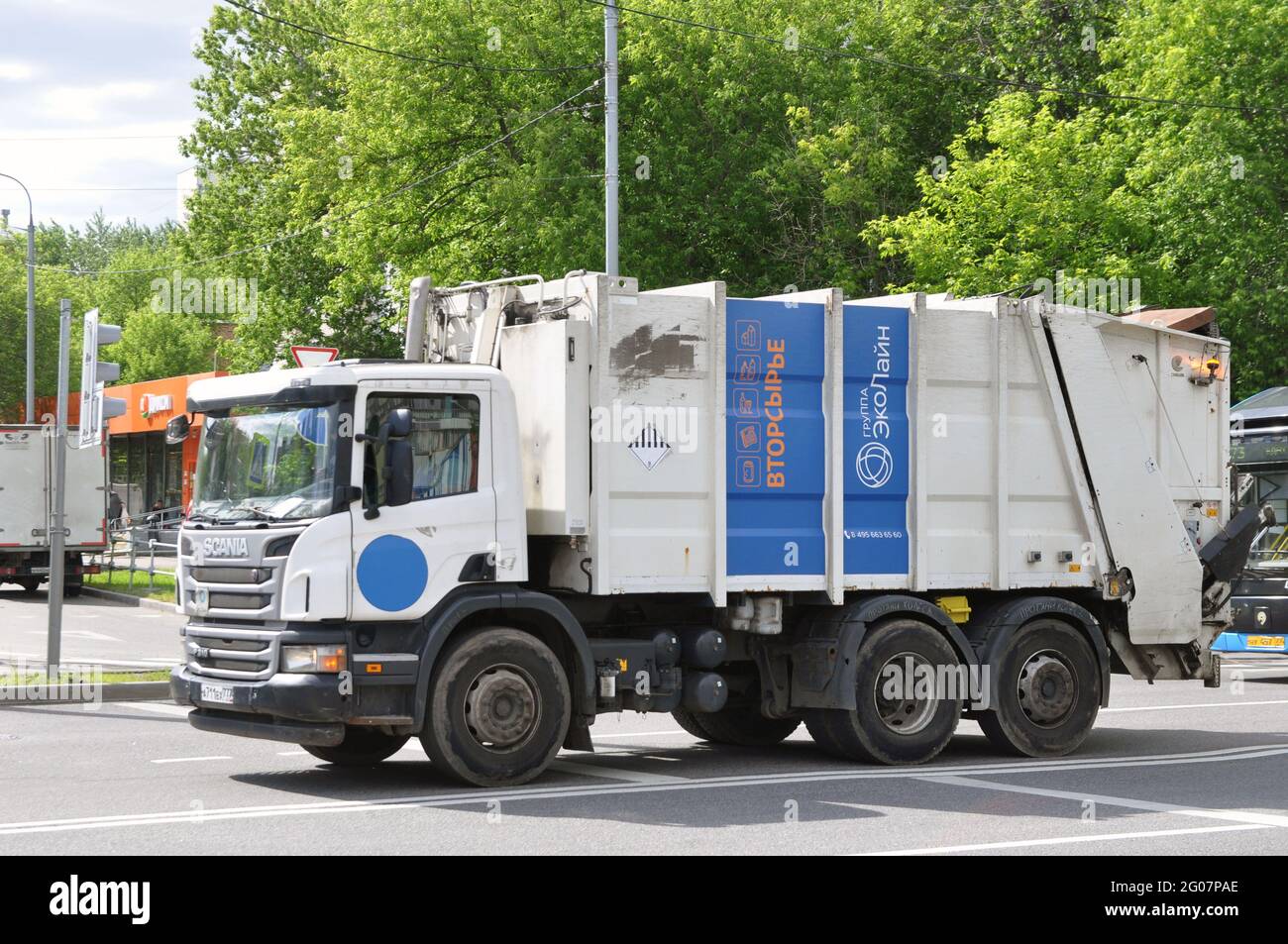 Specialized garbage collection vehicle on the city streets. Garbage ...