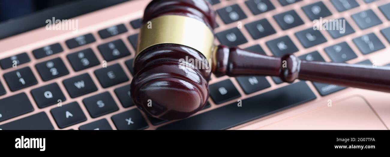 Judges hammer lying on laptop keyboard in courthouse closeup Stock ...