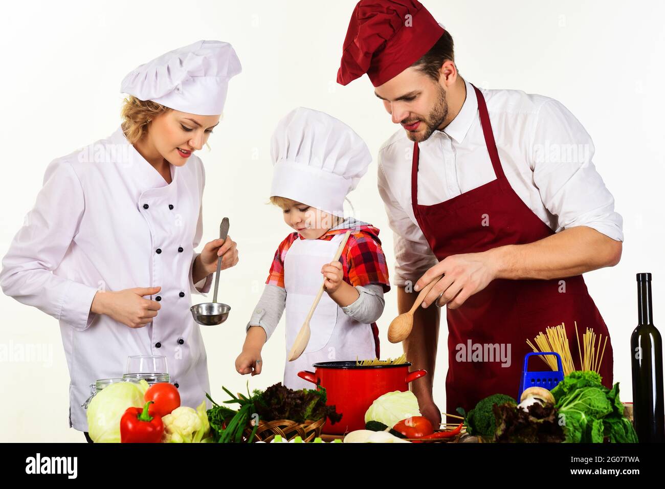 Healthy food at home. Happy family in kitchen preparing dinner. Son ...