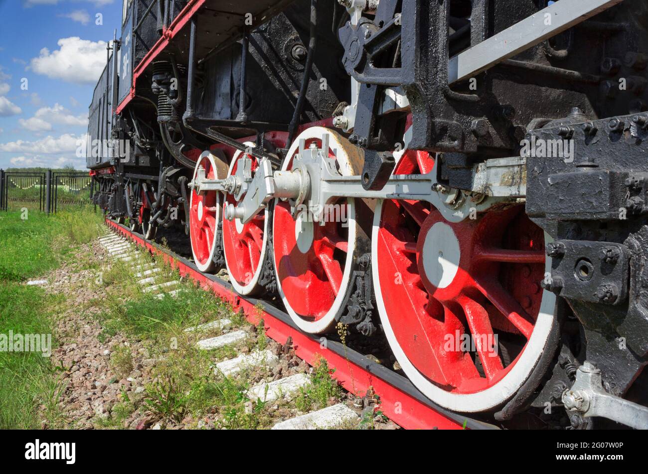 Wheels and coupling devices of a big old steam locomotive close-up ...