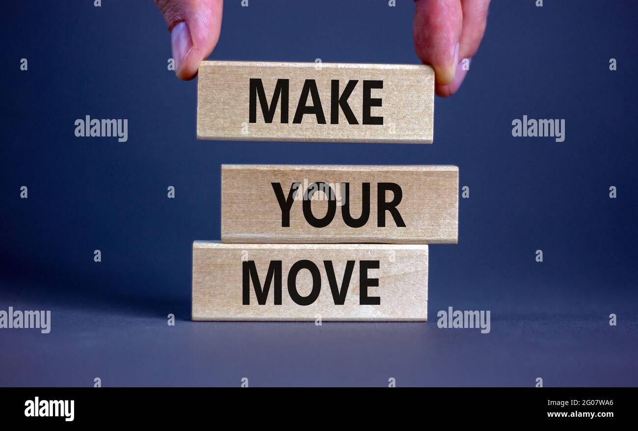 Make your move symbol. Wooden blocks with words 'Make your move'. Beautiful grey background ...