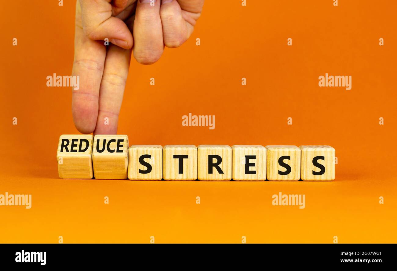 Reduce stress symbol. Businessman turns cubes and changes words 'stress ...